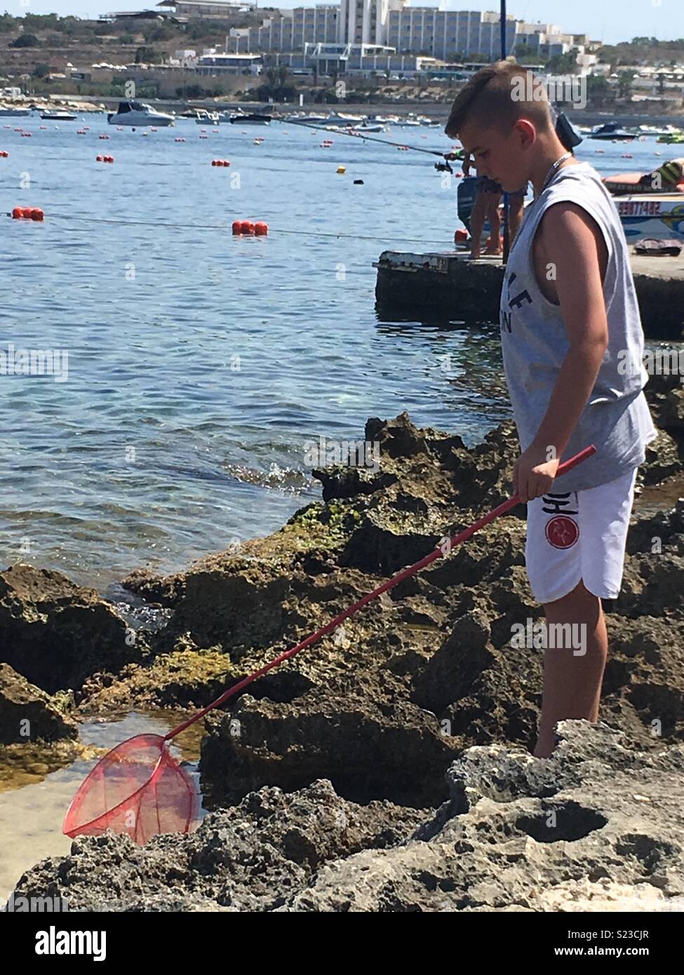 Boy fishing net hi-res stock photography and images - Alamy