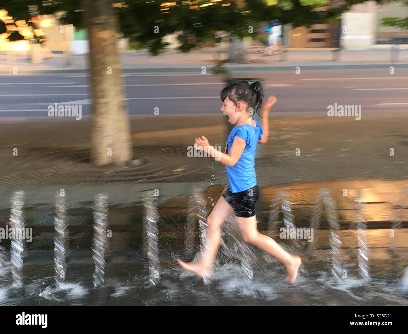 Girl running water fountain hi-res stock photography and images - Alamy