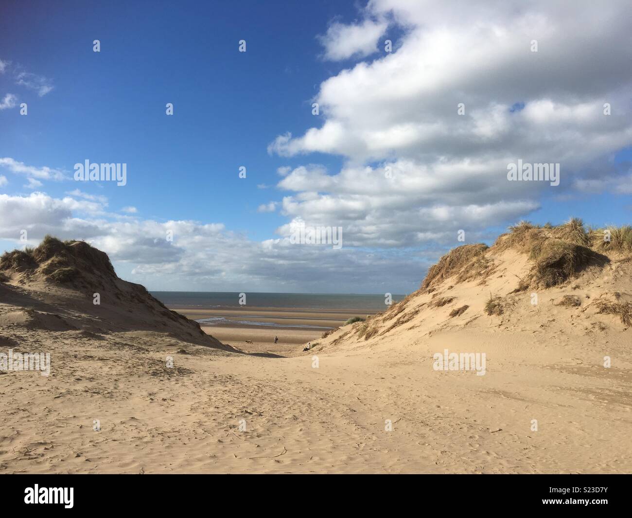 Sea view through sand dunes Stock Photo - Alamy