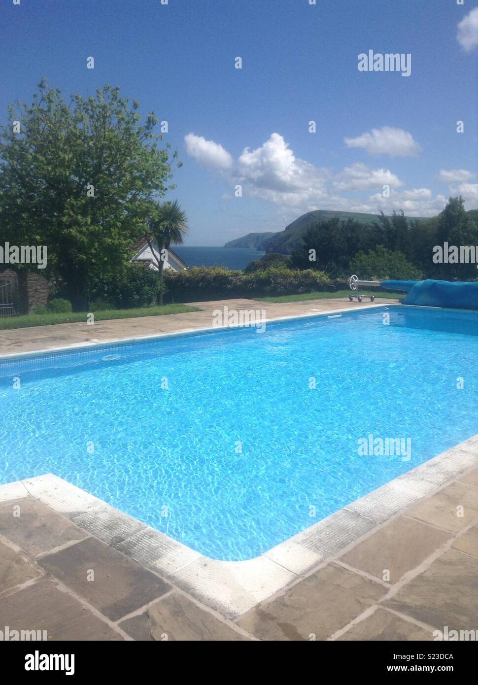 Outside swimming pool with sea view Stock Photo - Alamy