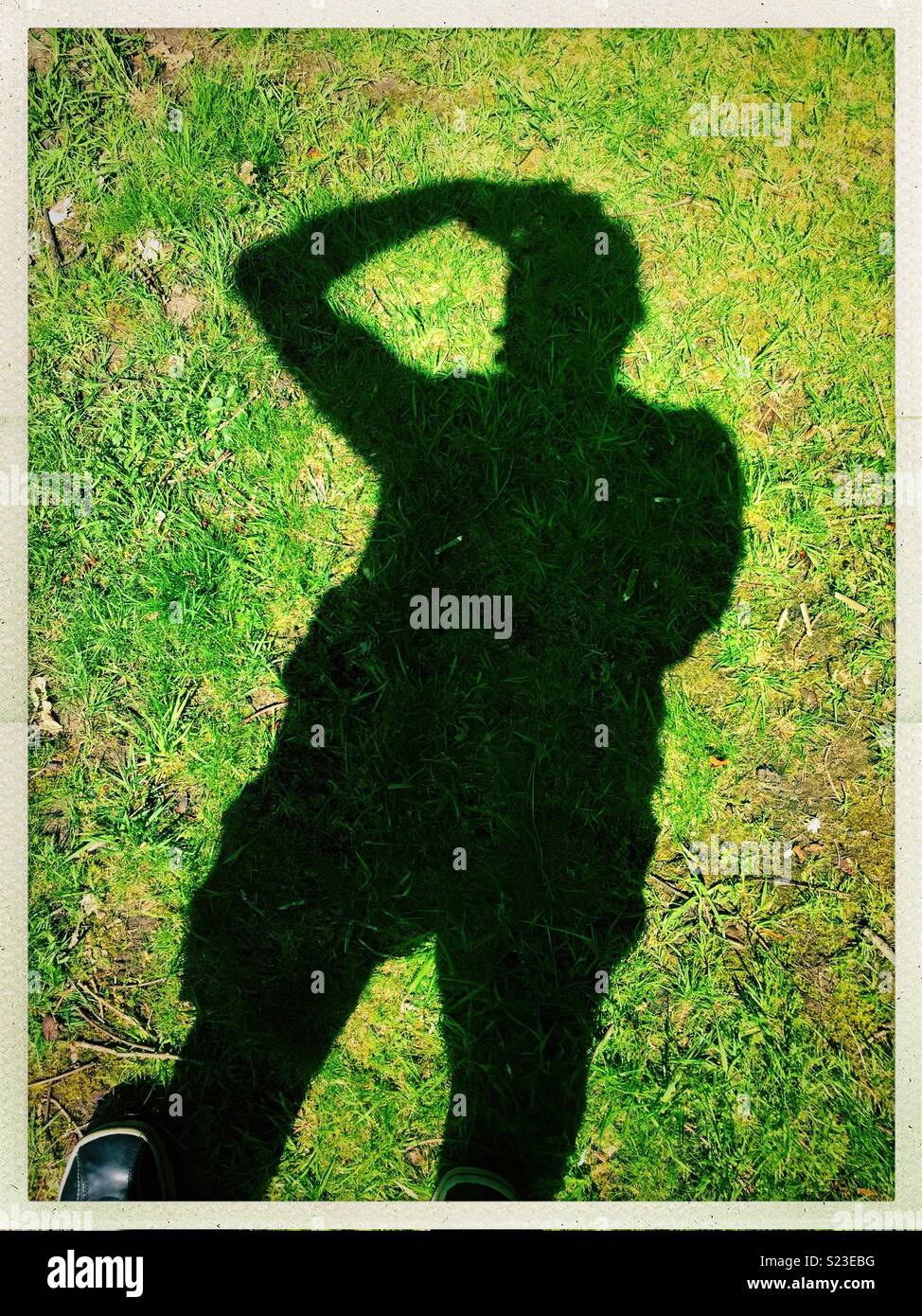Man shadow grass hi-res stock photography and images - Alamy