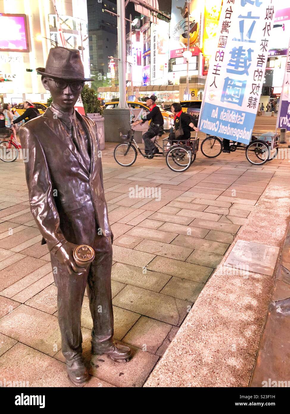 Standing bronze statue of a man holding a coffee cup in Taipei Stock ...