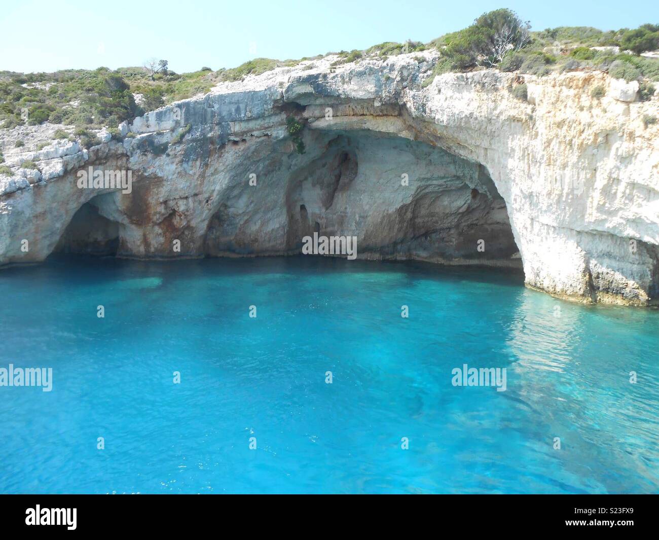 Turquoise waters around caves off the coast of Kefalonia, Greece Stock ...