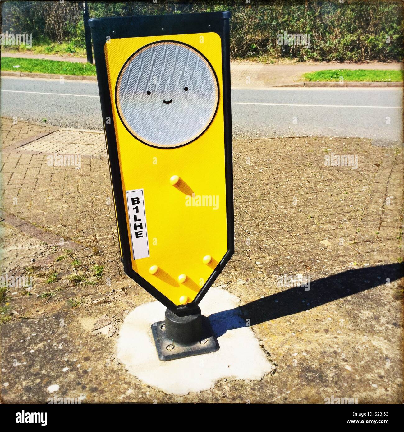 Yellow street sign with smiley face Stock Photo - Alamy