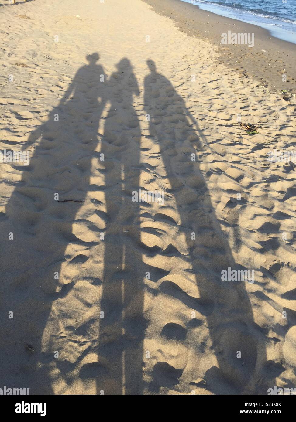 Shadows on the beach Stock Photo - Alamy