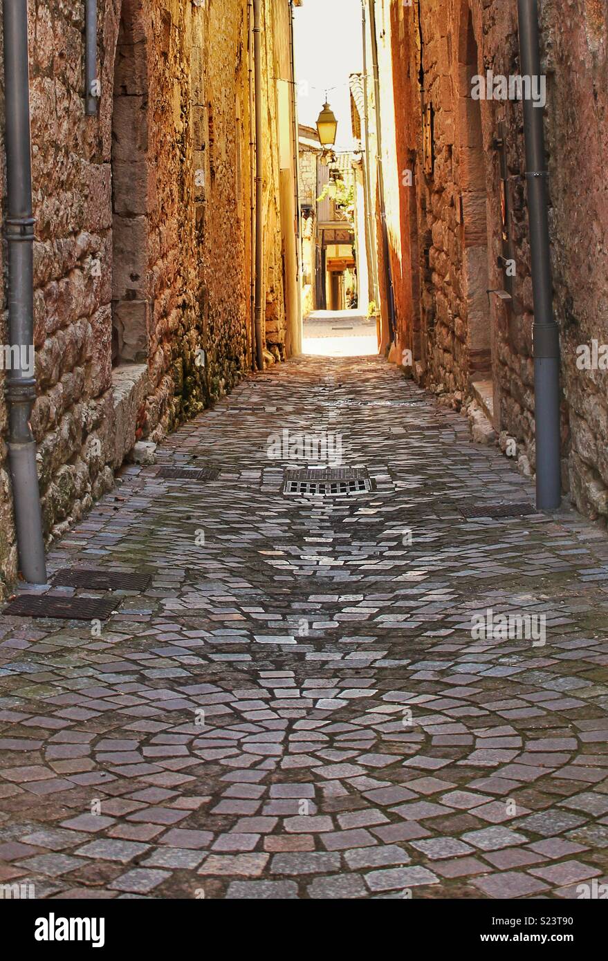 An alleyway in a French town in the summer Stock Photo - Alamy