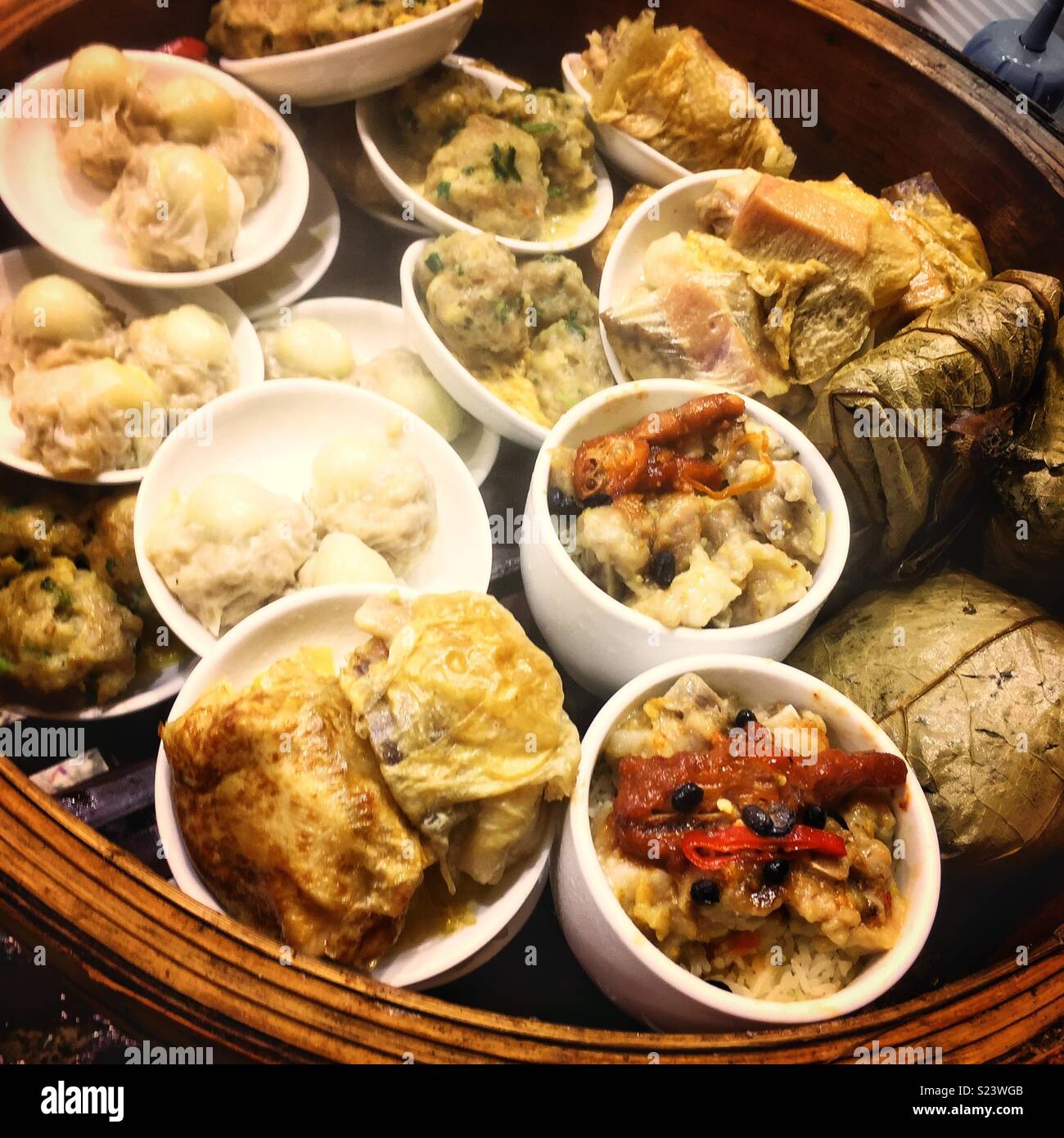Traditional Cantonese dim sum, for sale as takeaway food in a street ...