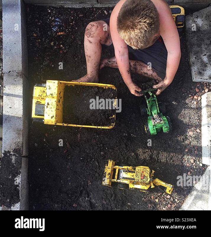 Child digging mud hi-res stock photography and images - Alamy