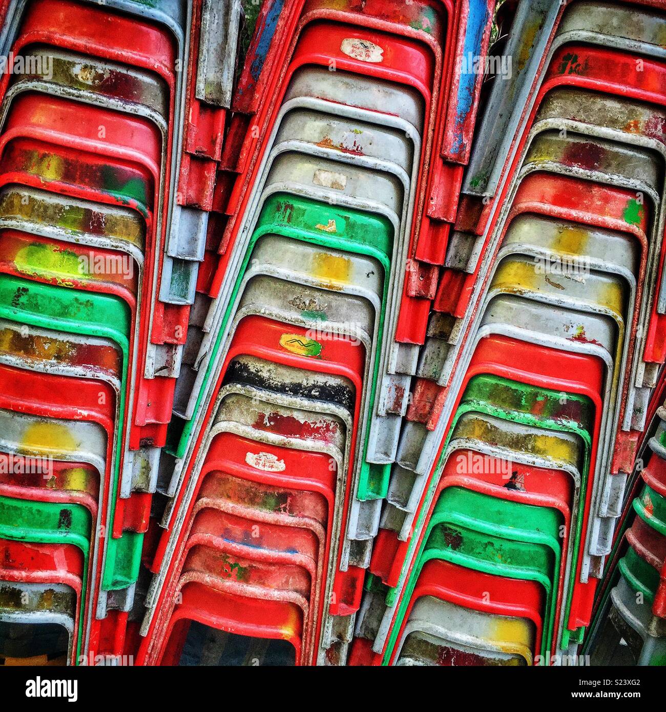 Coloured plastic stools in a street restaurant in Yuen Long, New ...
