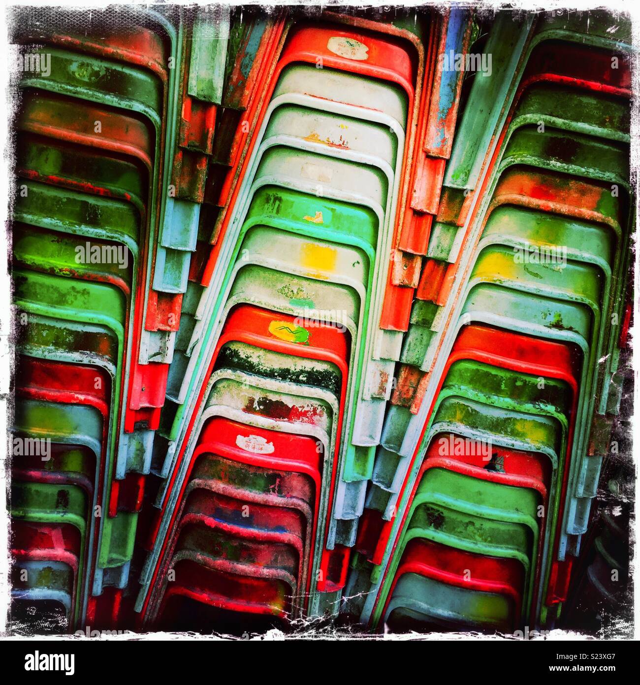 Coloured plastic stools in a street restaurant in Yuen Long, New ...