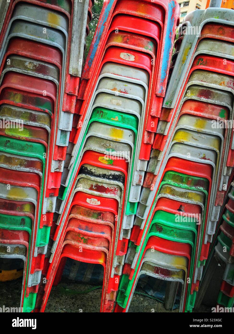 Coloured plastic stools in a street restaurant in Yuen Long, New ...