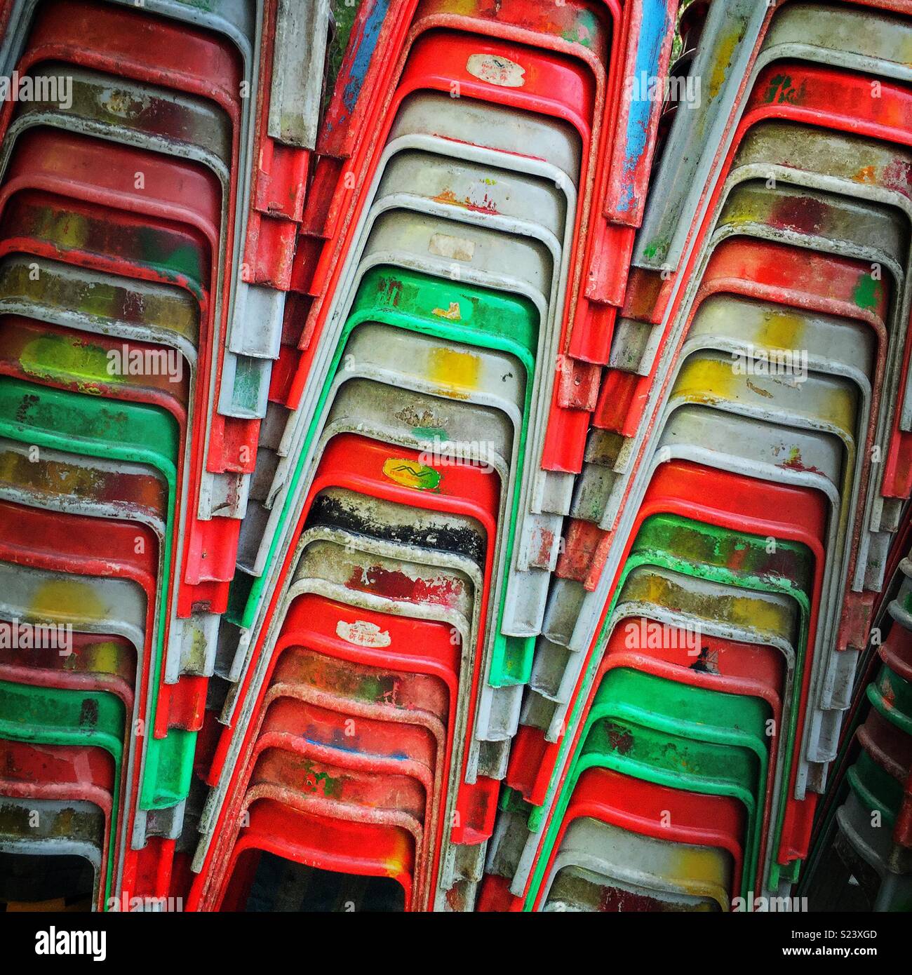 Coloured plastic stools in a street restaurant in Yuen Long, New ...
