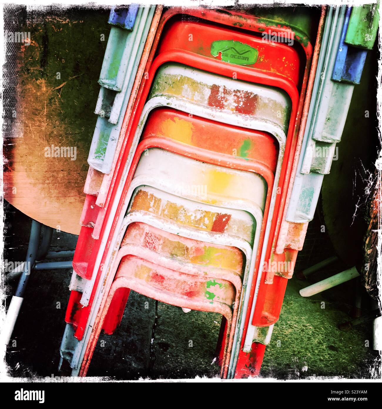 Coloured plastic stools in a street restaurant in Yuen Long, New ...