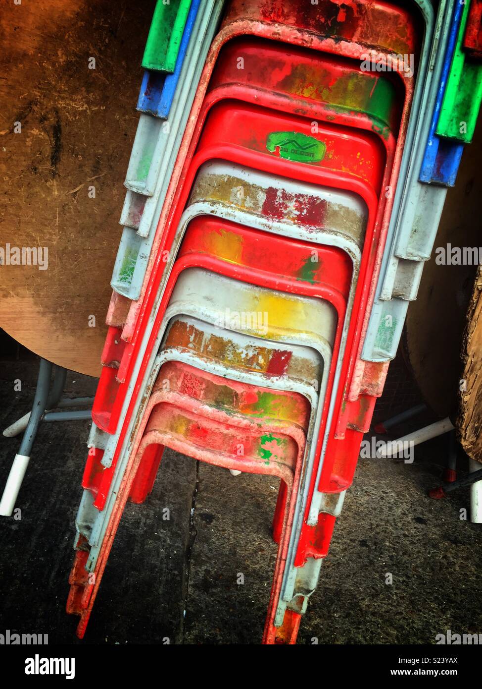 Coloured plastic stools in a street restaurant in Yuen Long, New ...