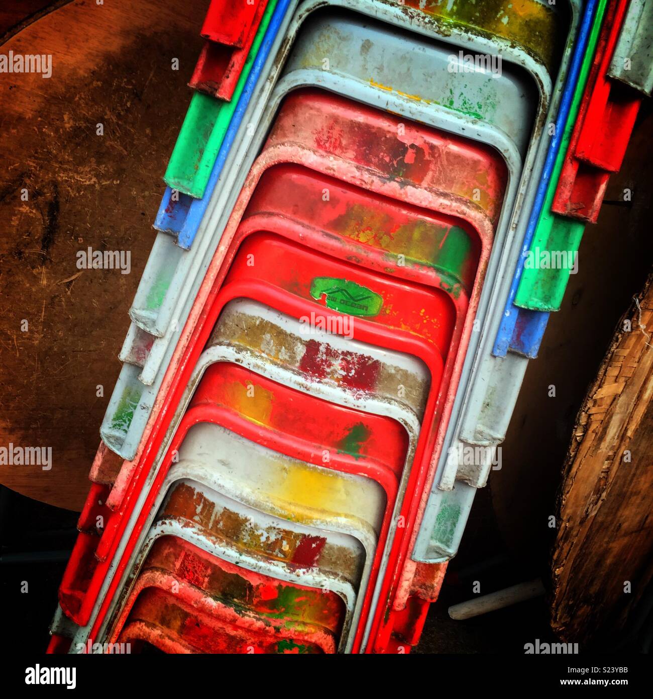 Coloured plastic stools in a street restaurant in Yuen Long, New ...