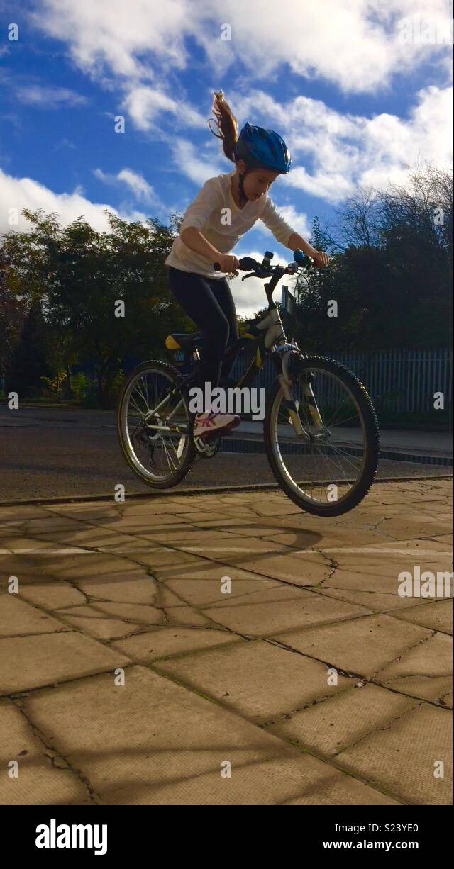 Blue sky playing jumping bike Stock Photo - Alamy