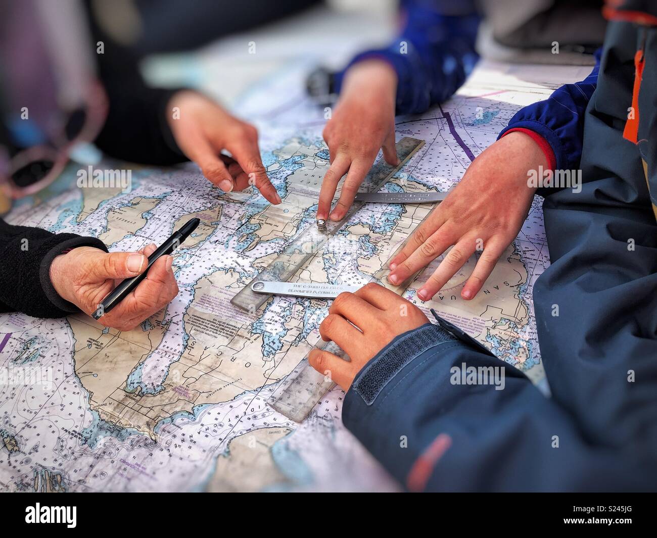 Lesson in navigation on the boat Stock Photo - Alamy