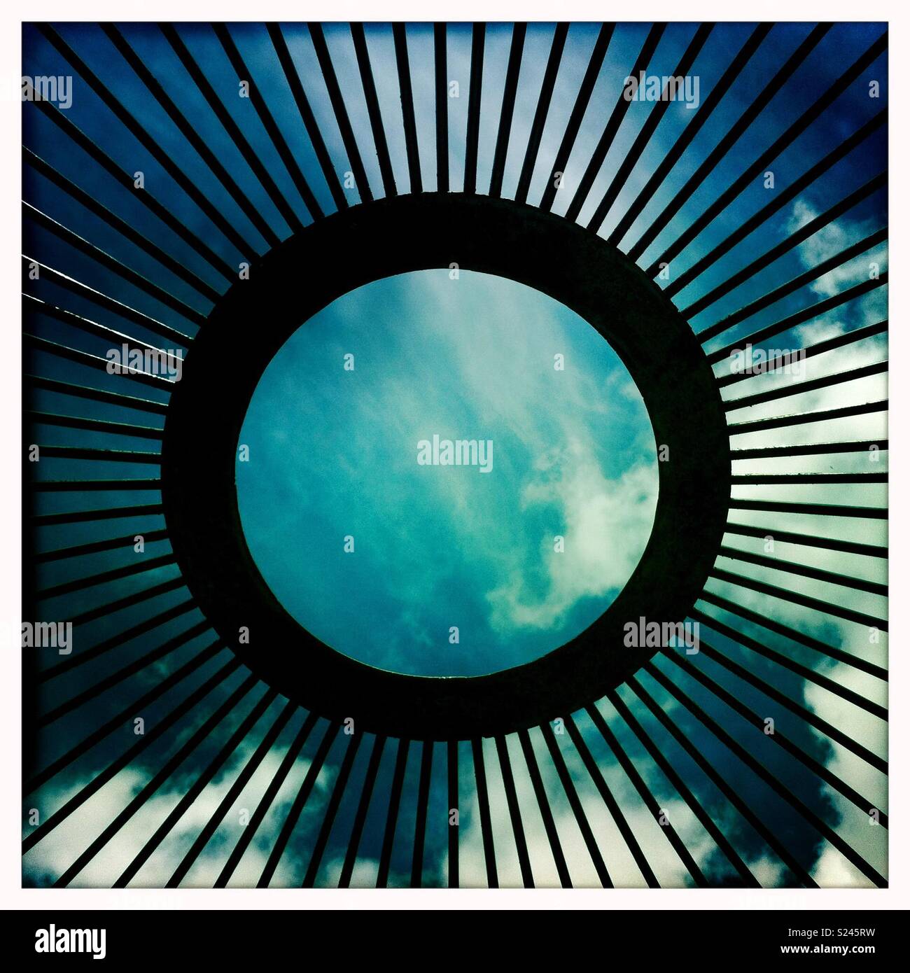 Sky with clouds viewed through a circular opening Stock Photo - Alamy