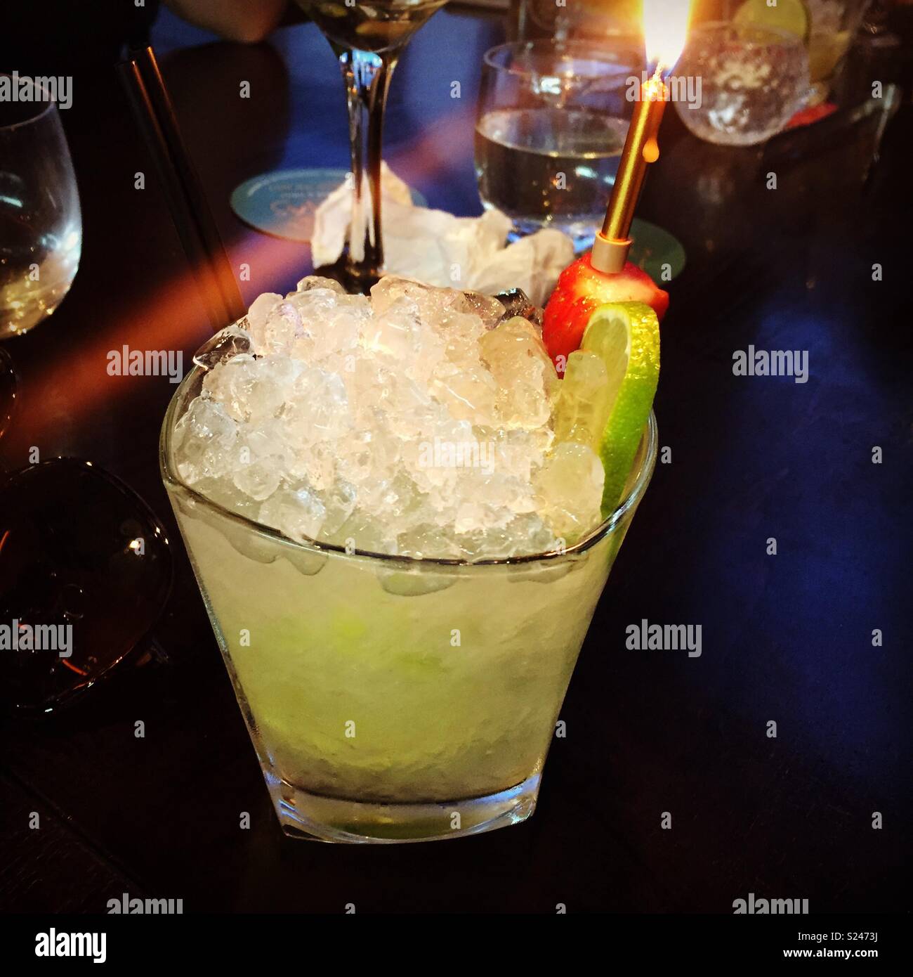 Cocktail with candle Stock Photo - Alamy