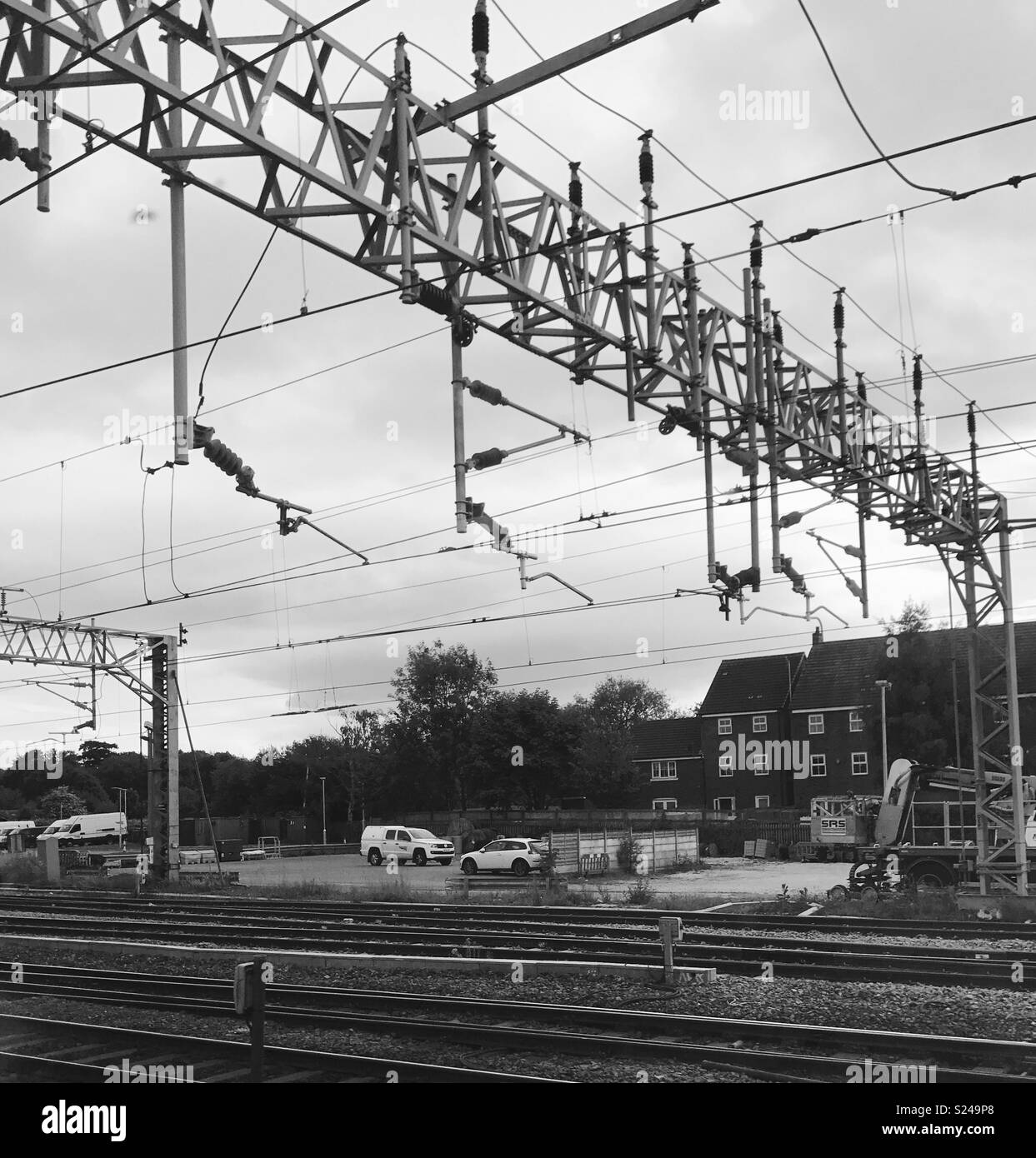 Overhead electricity pylons and cables Stock Photo - Alamy