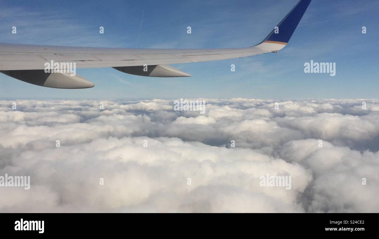 Aeroplane Wing over White Clouds Stock Photo - Alamy