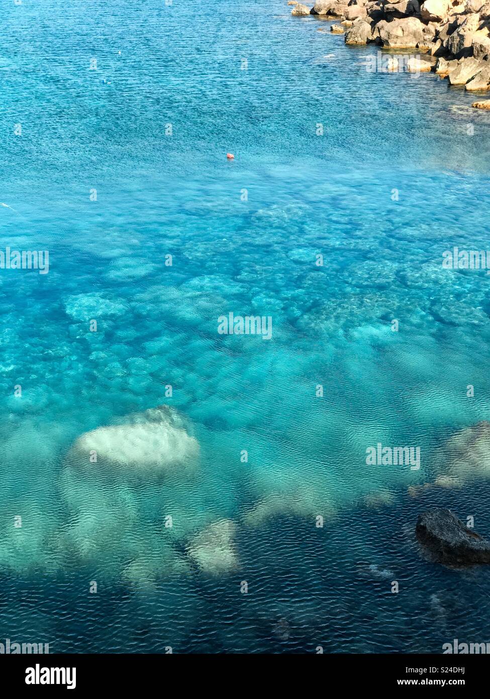 Clear light blue water Stock Photo - Alamy