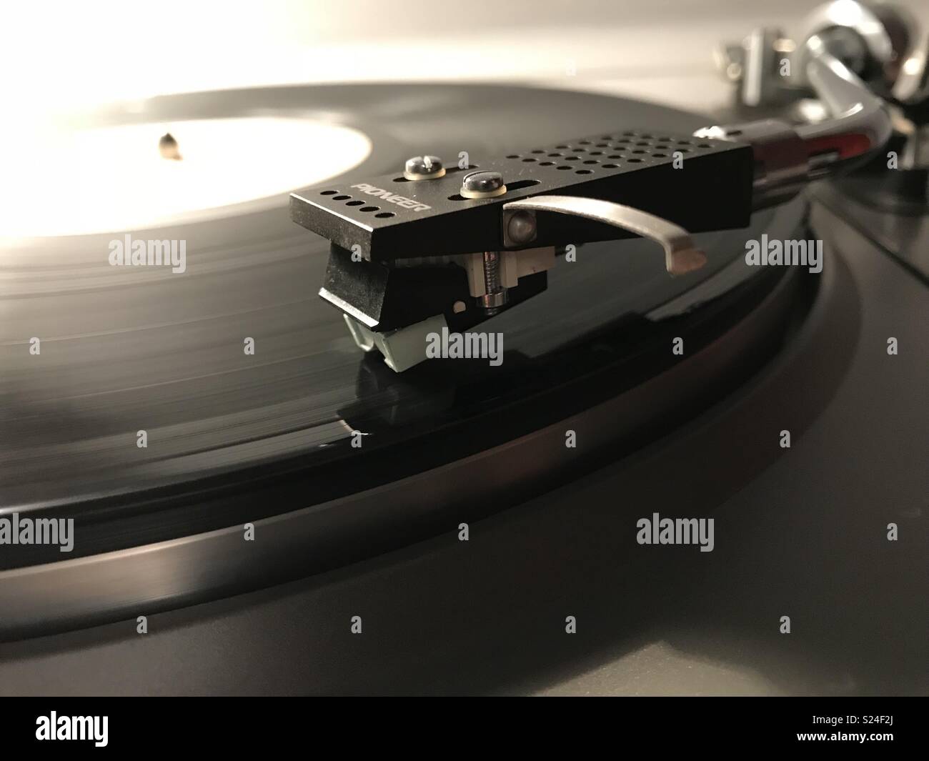 Vinyl record playing on turntable Stock Photo - Alamy
