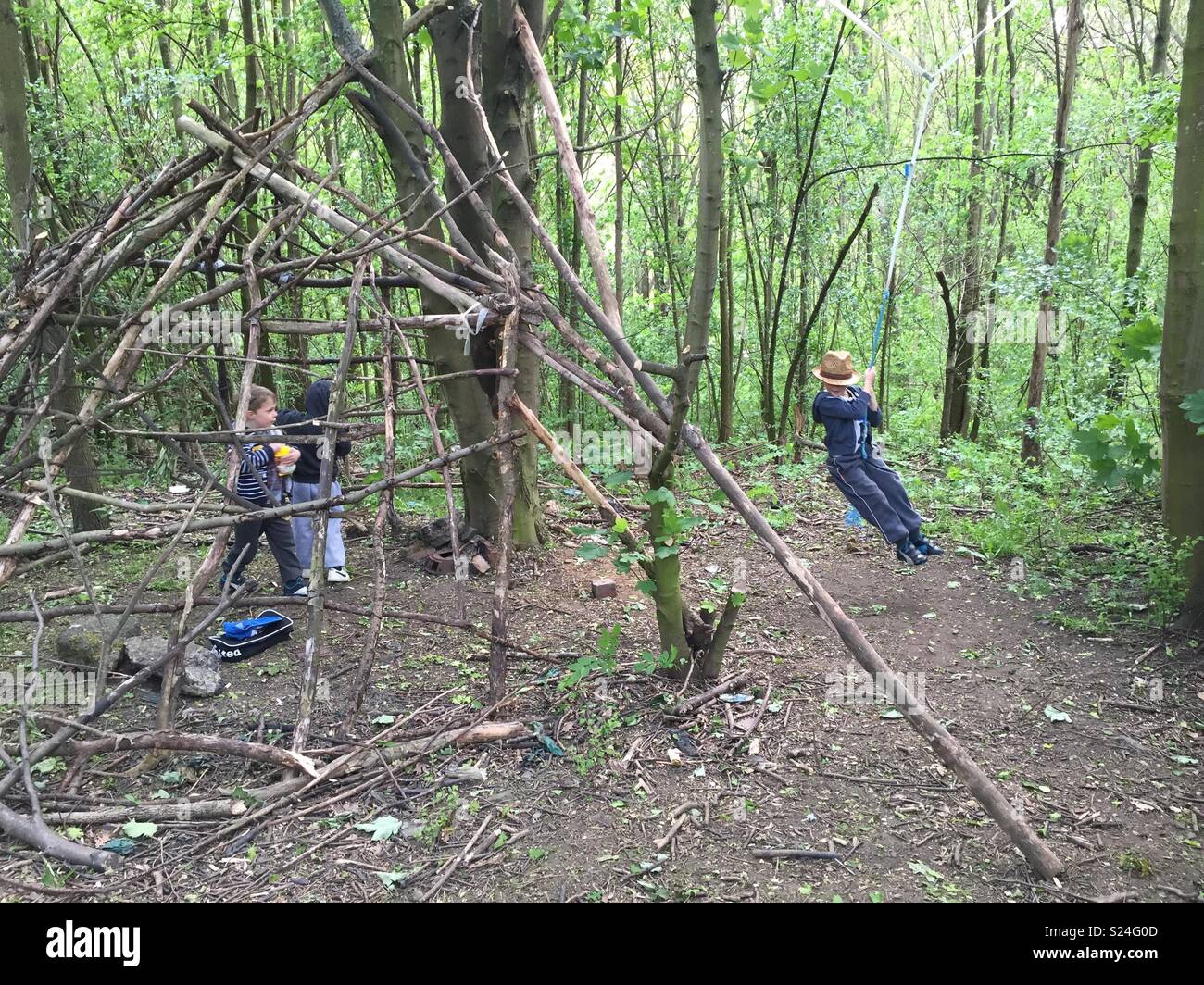 Playing in the forest Stock Photo - Alamy