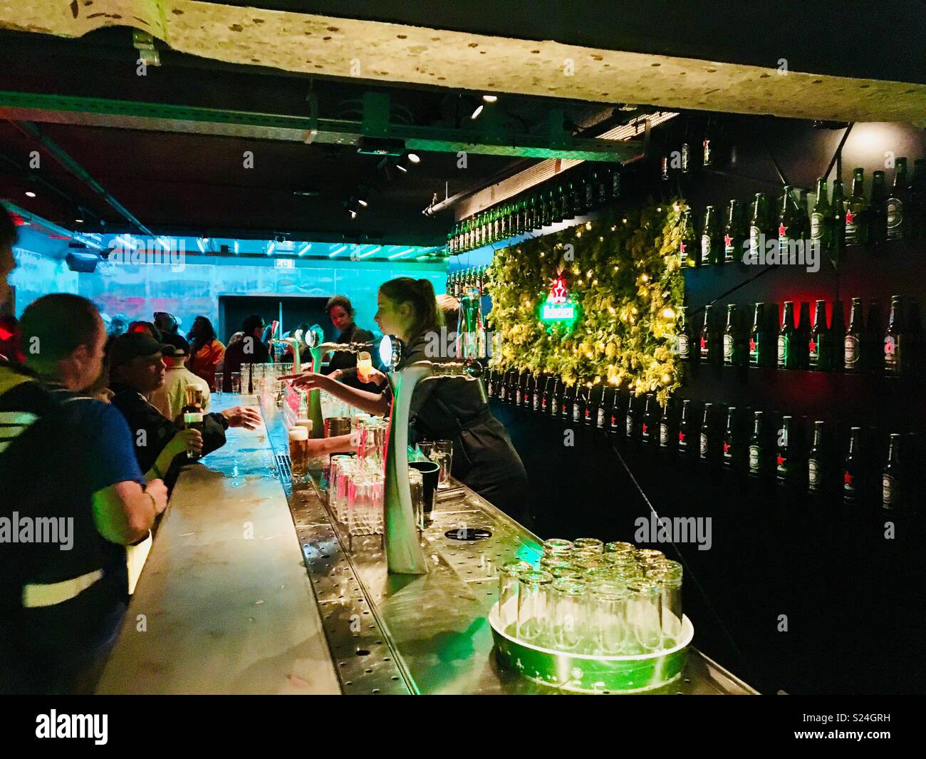 Bar inside the Heineken Experience museum in Amsterdam Stock Photo - Alamy