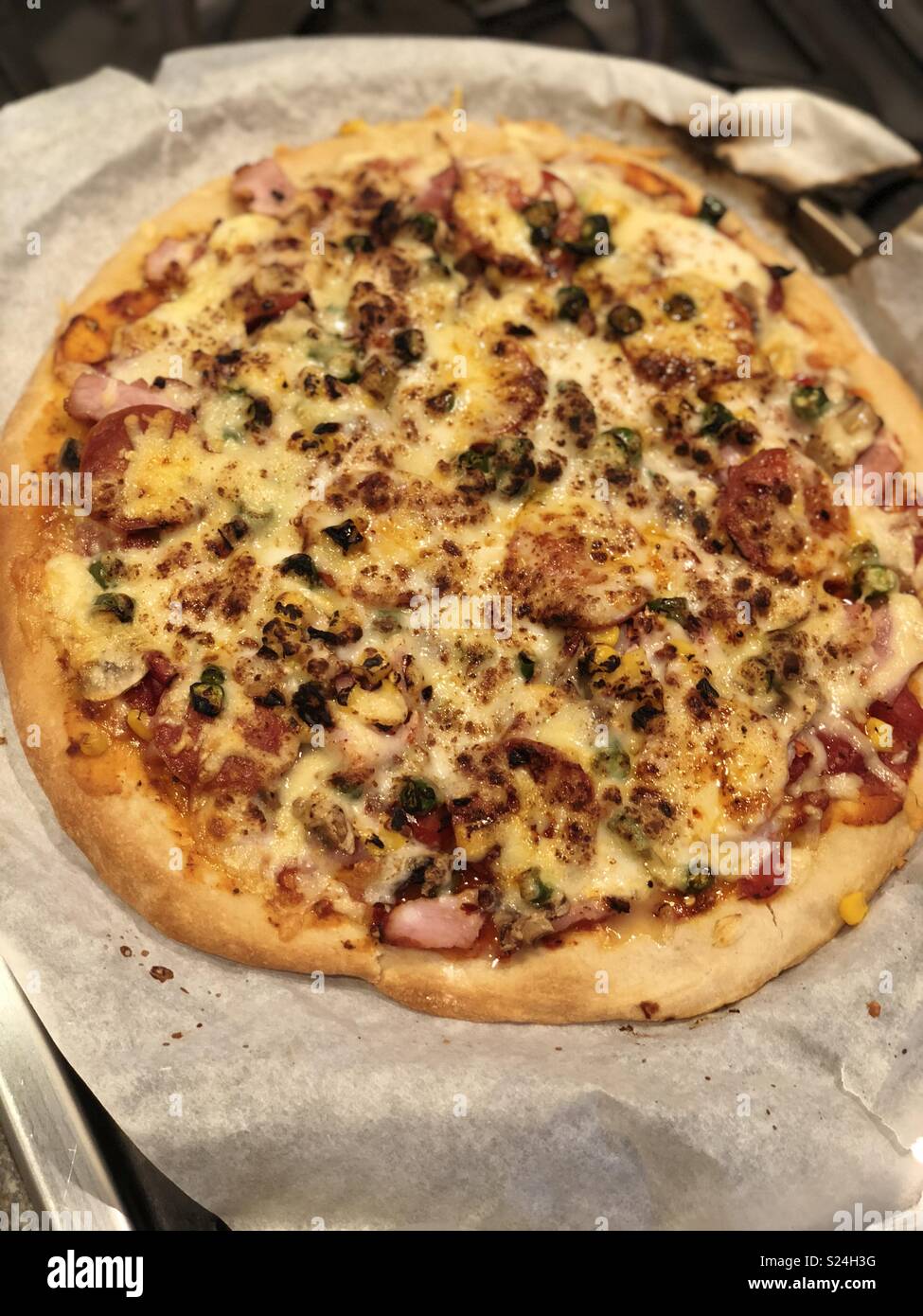 Rustic homemade pizza Stock Photo - Alamy