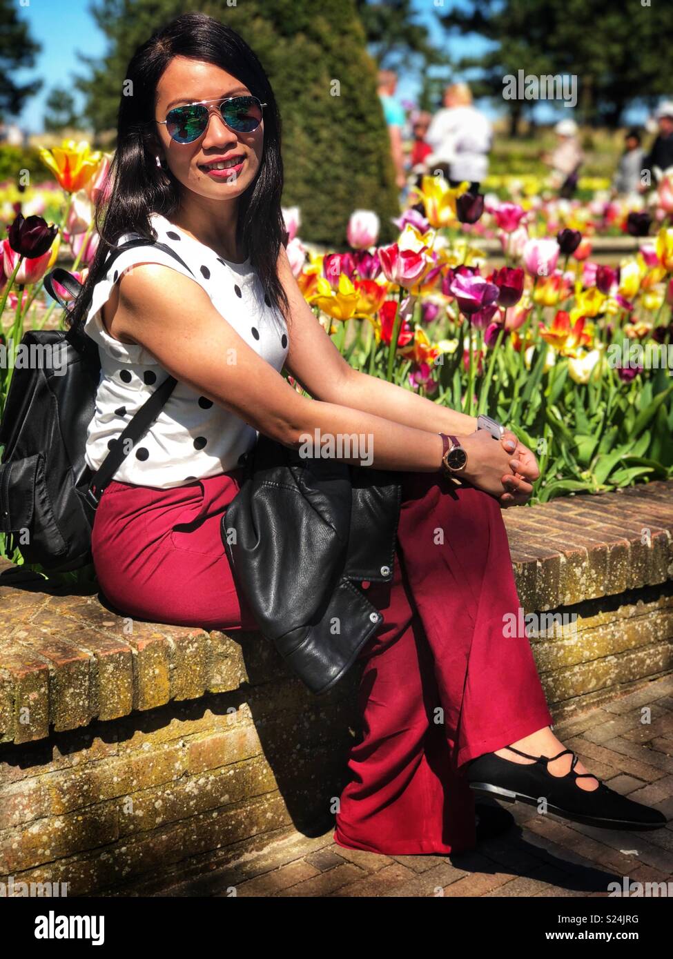 Beautiful woman tulips on smartphone stock photos and images - Alamy