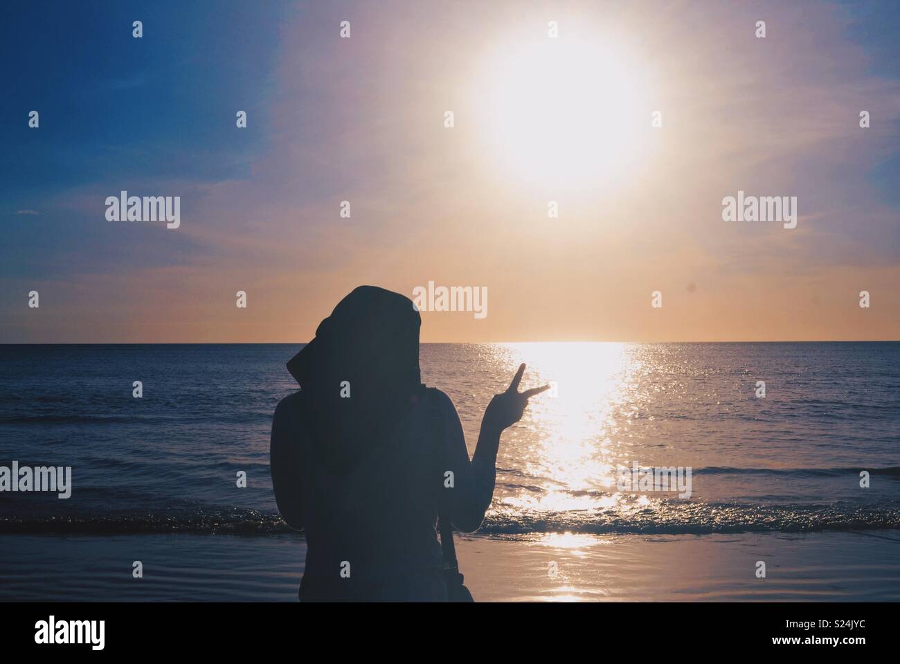 Sunset vs human Stock Photo - Alamy