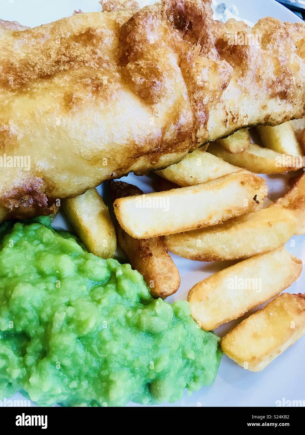 Fish chips and mushy peas Stock Photo - Alamy