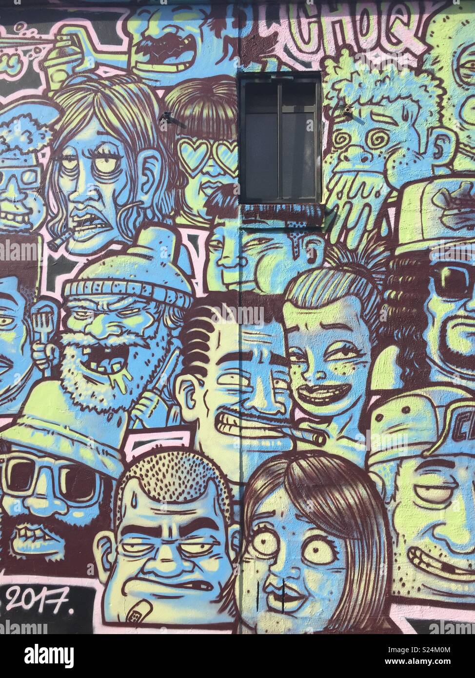 Crowd of faces street art Stock Photo - Alamy