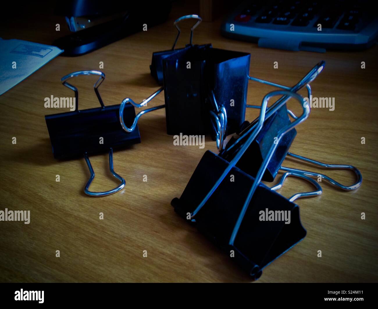 Banker's clips on office desk Stock Photo - Alamy