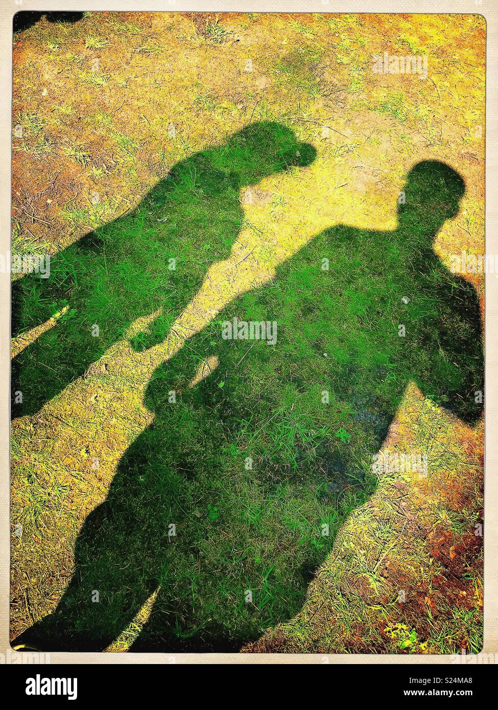Shadow of man and child Stock Photo - Alamy
