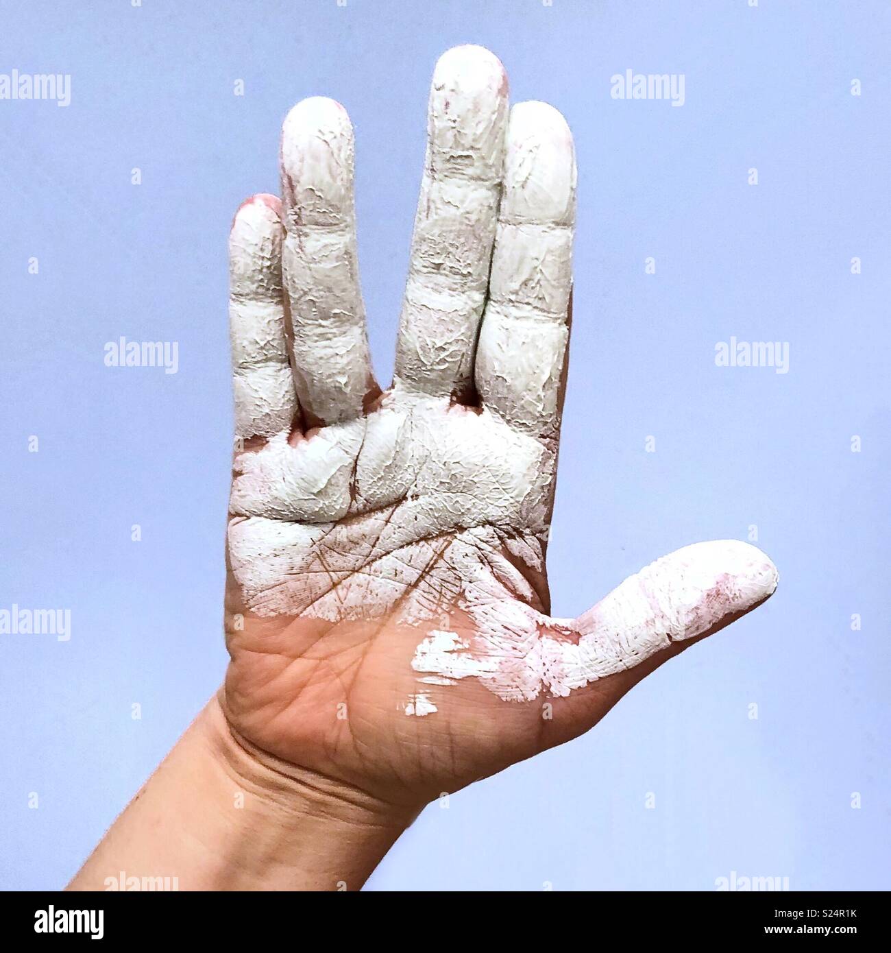 A closeup of a paint covered hand making the Vulcan salute Stock Photo ...