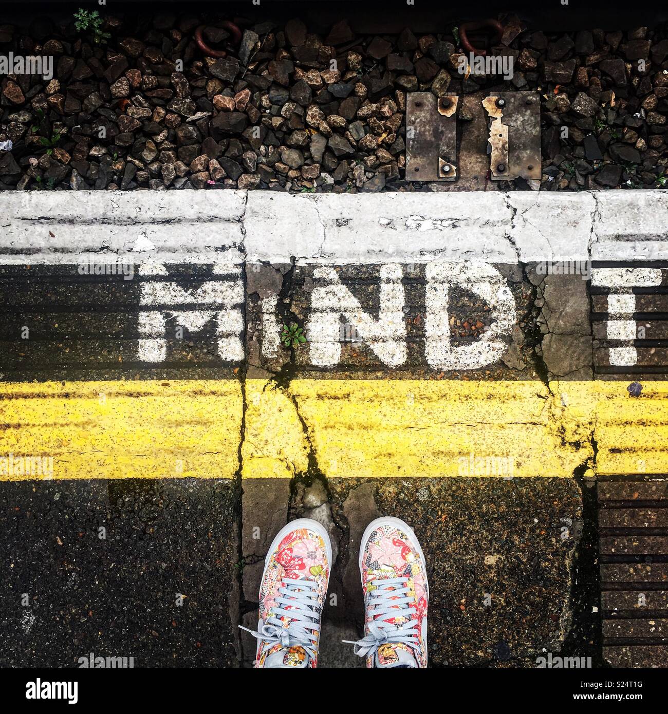 Funky trainers at the tube station Stock Photo - Alamy