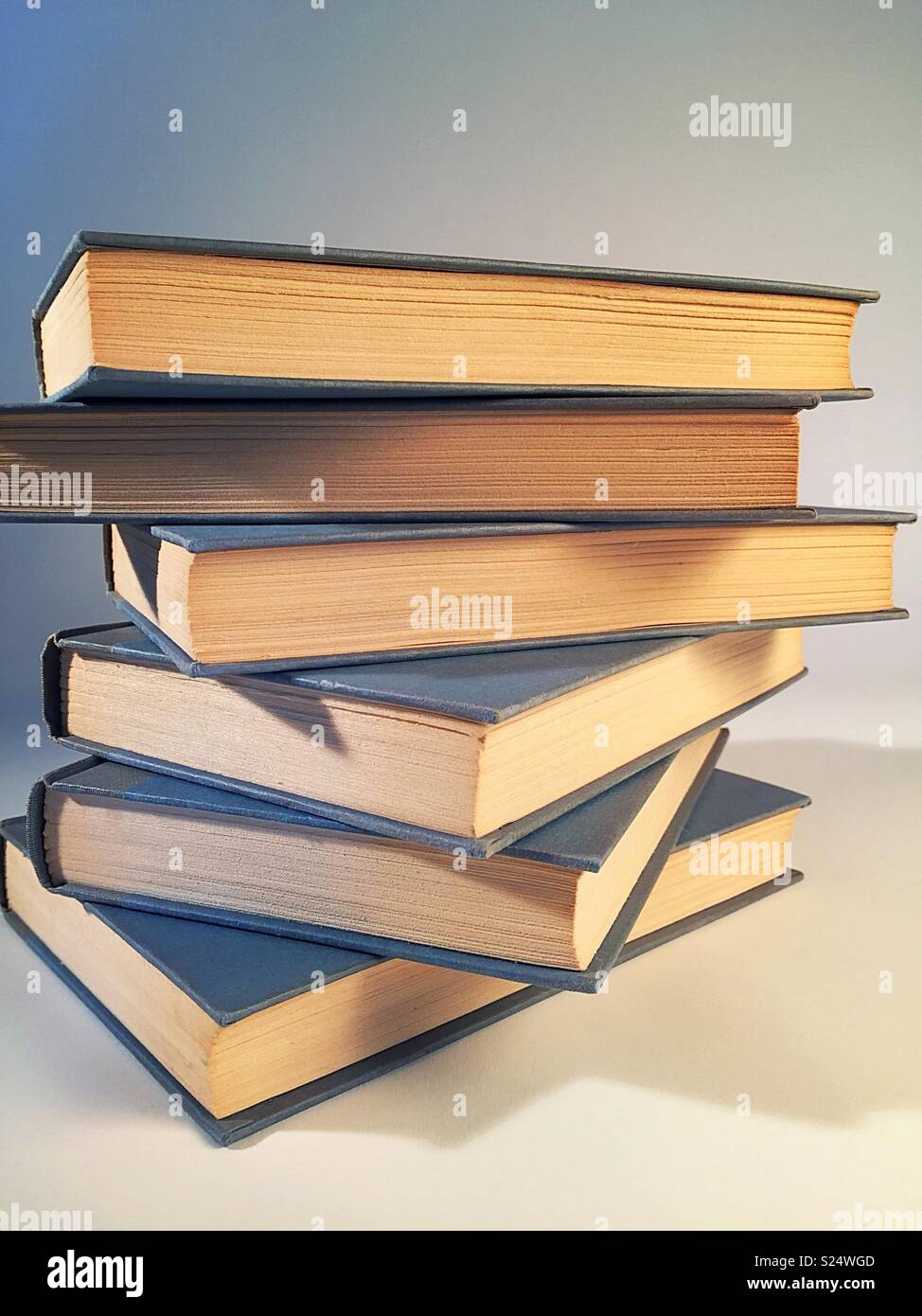 Still life of a stack of hard back books Stock Photo - Alamy