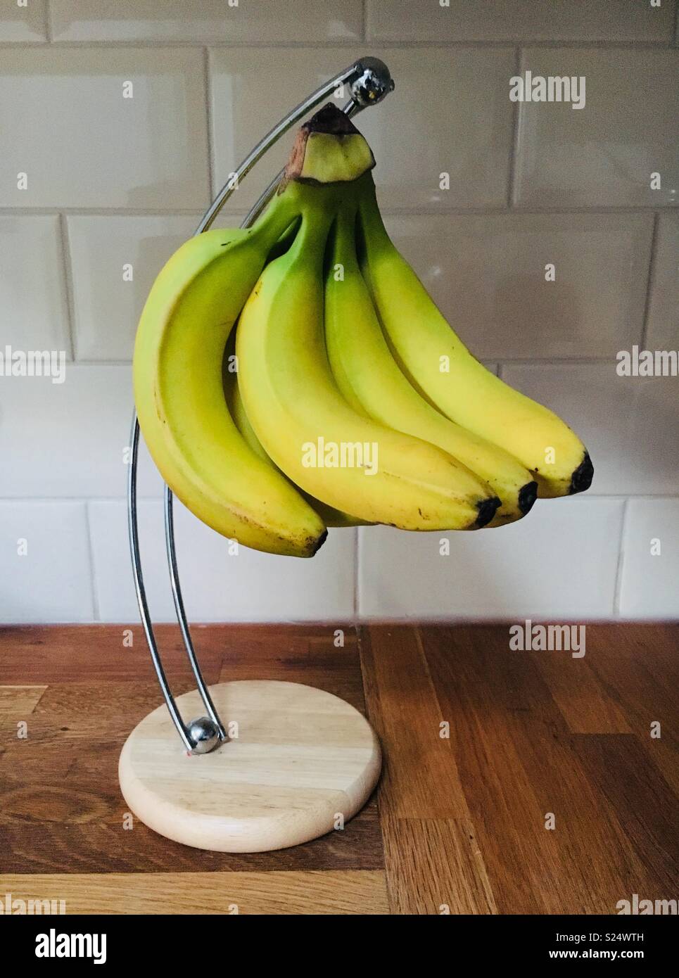 Bananas on kitchen stand Stock Photo - Alamy