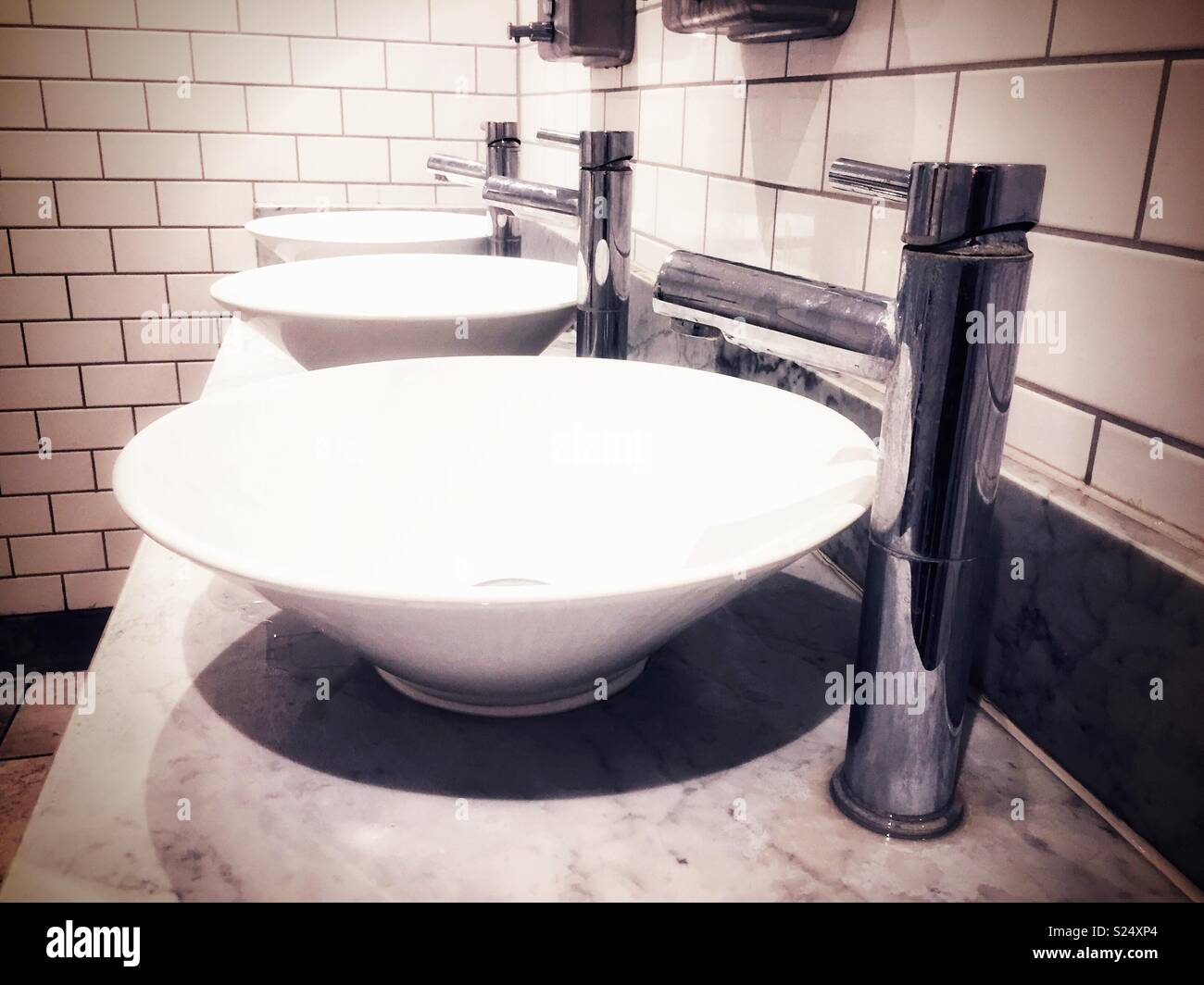 Public bathroom sinks hi-res stock photography and images - Alamy