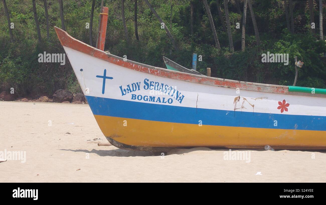 Boat on Goan beach Stock Photo - Alamy