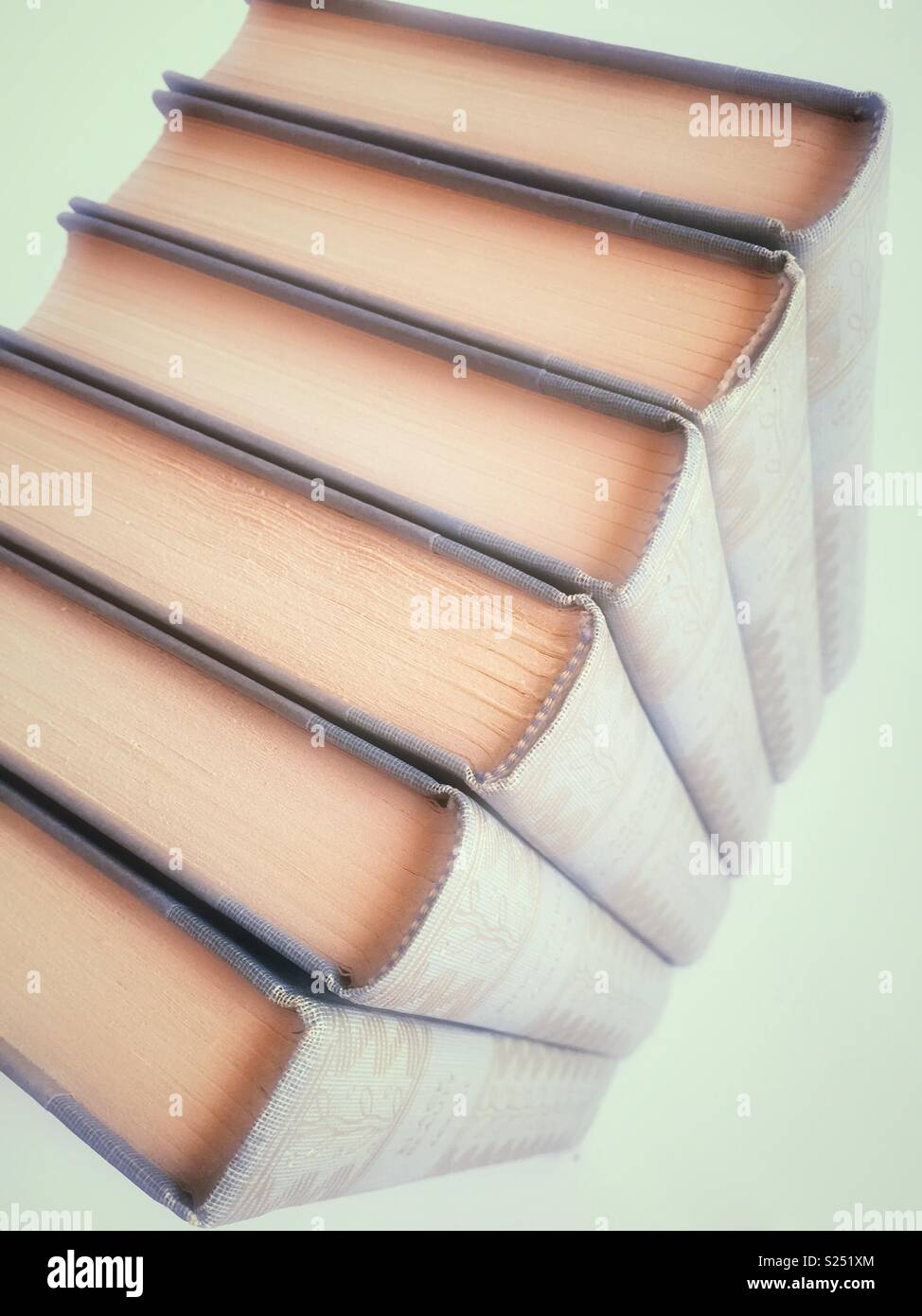 Close up of vintage books standing up in a row Stock Photo - Alamy