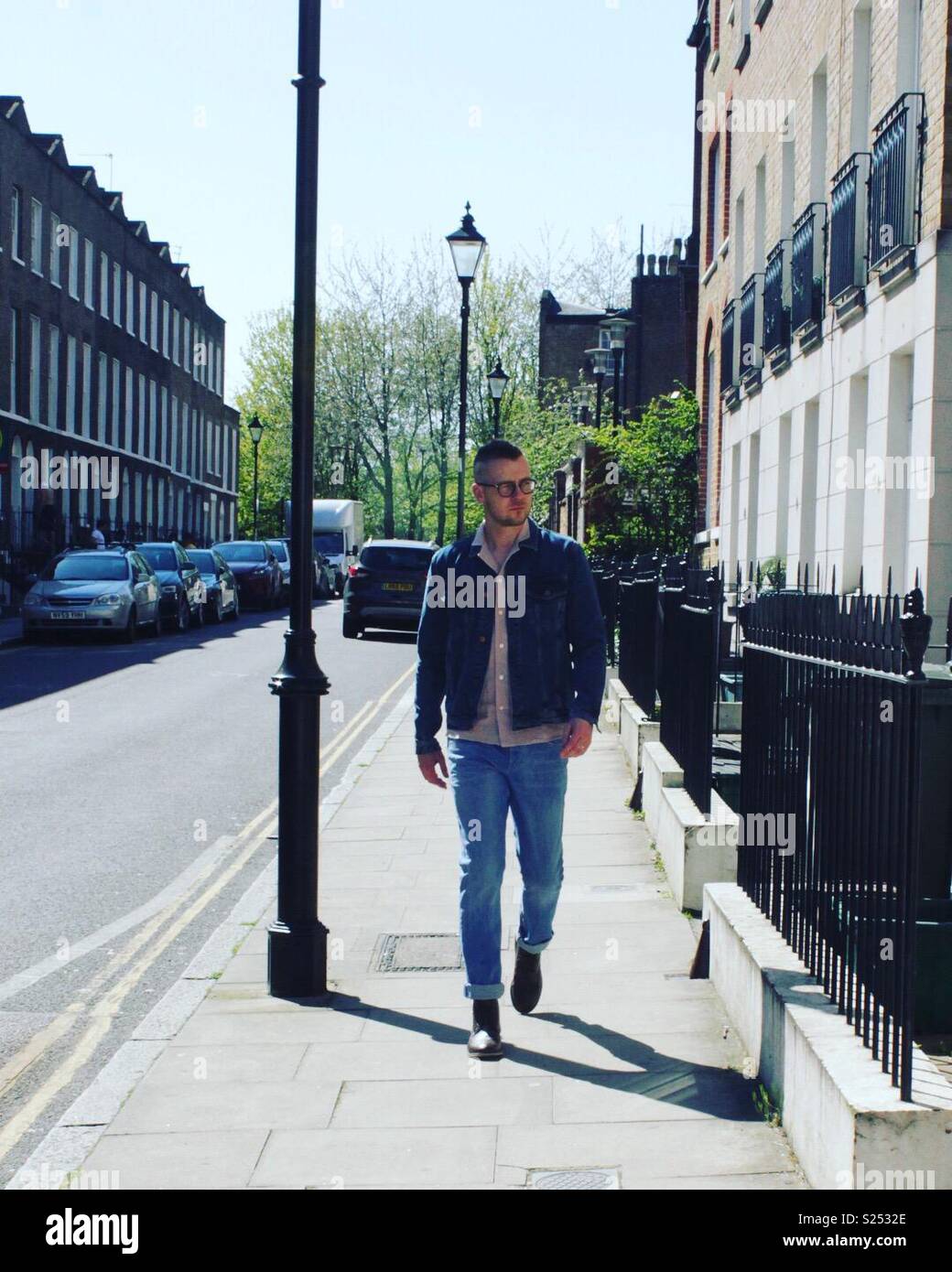 Man walking down street london hi-res stock photography and images - Alamy