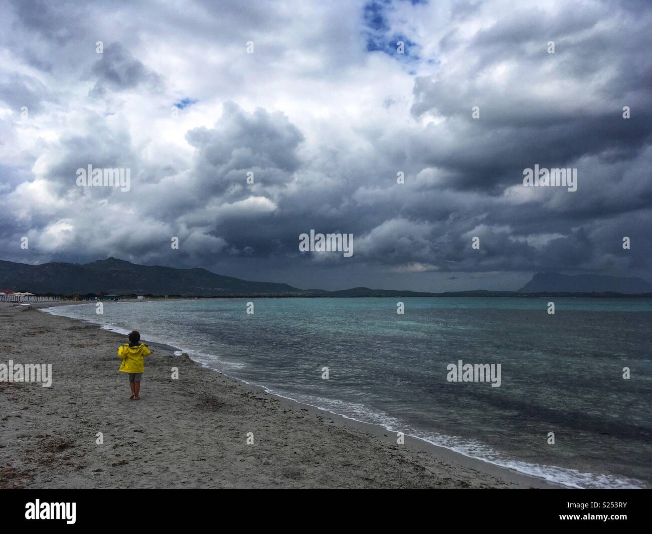 Stormy beach boy hi-res stock photography and images - Alamy