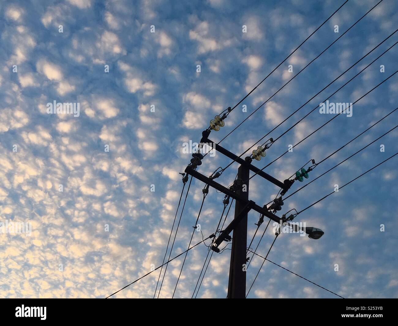 Aerial power lines against the sky Stock Photo - Alamy