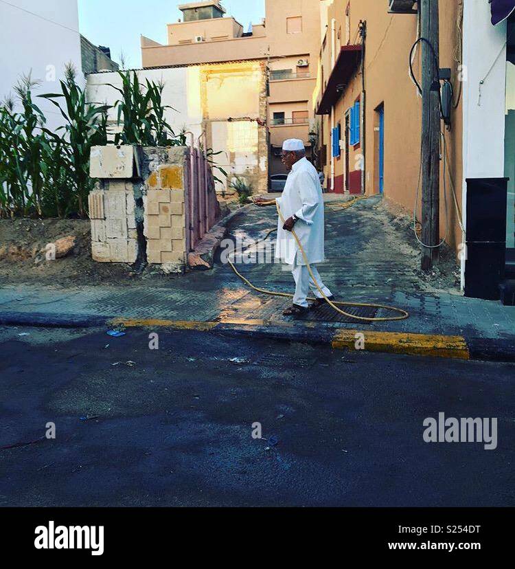 Watering with hose africa hi-res stock photography and images - Alamy