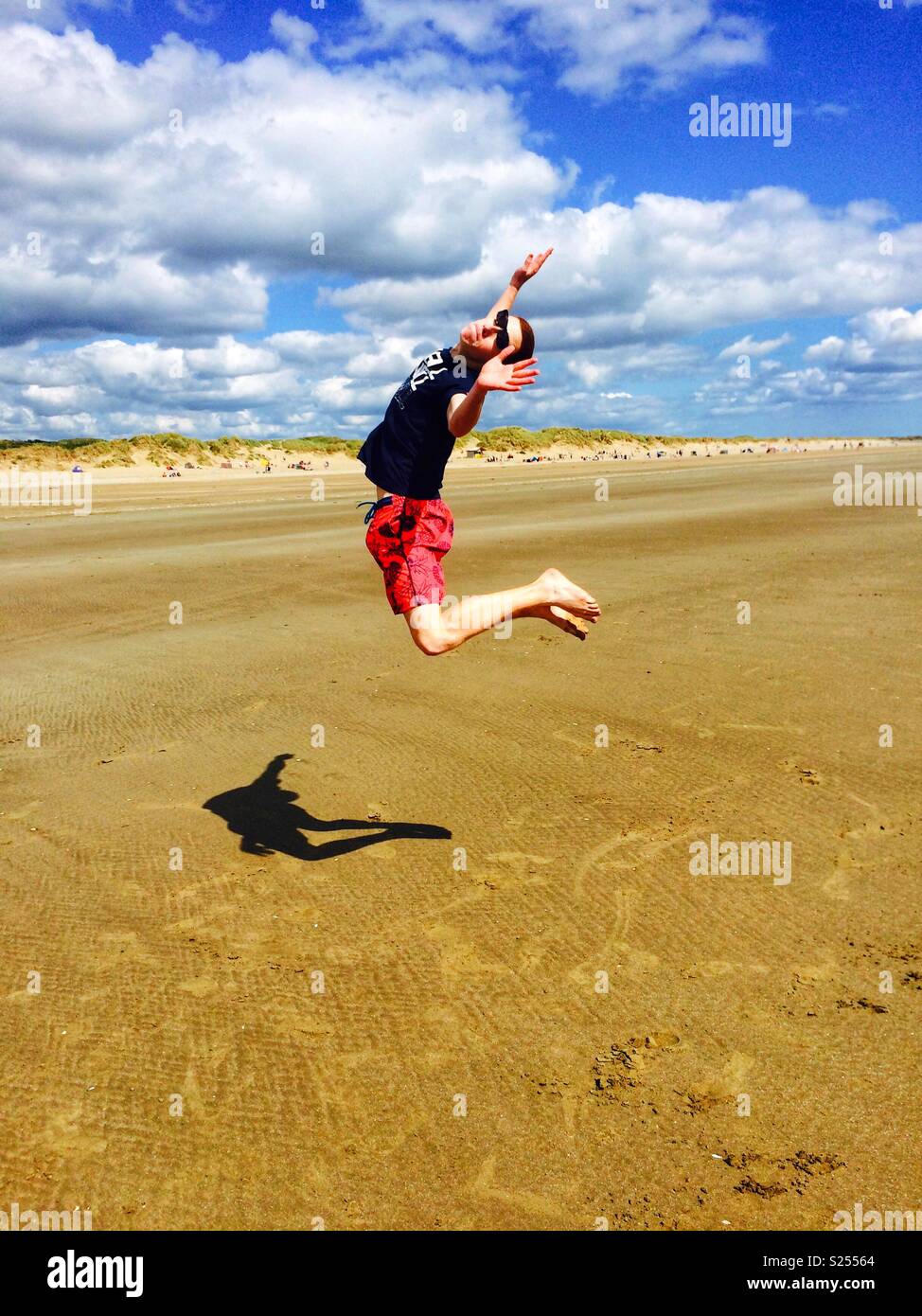 Child jump sand hi-res stock photography and images - Alamy
