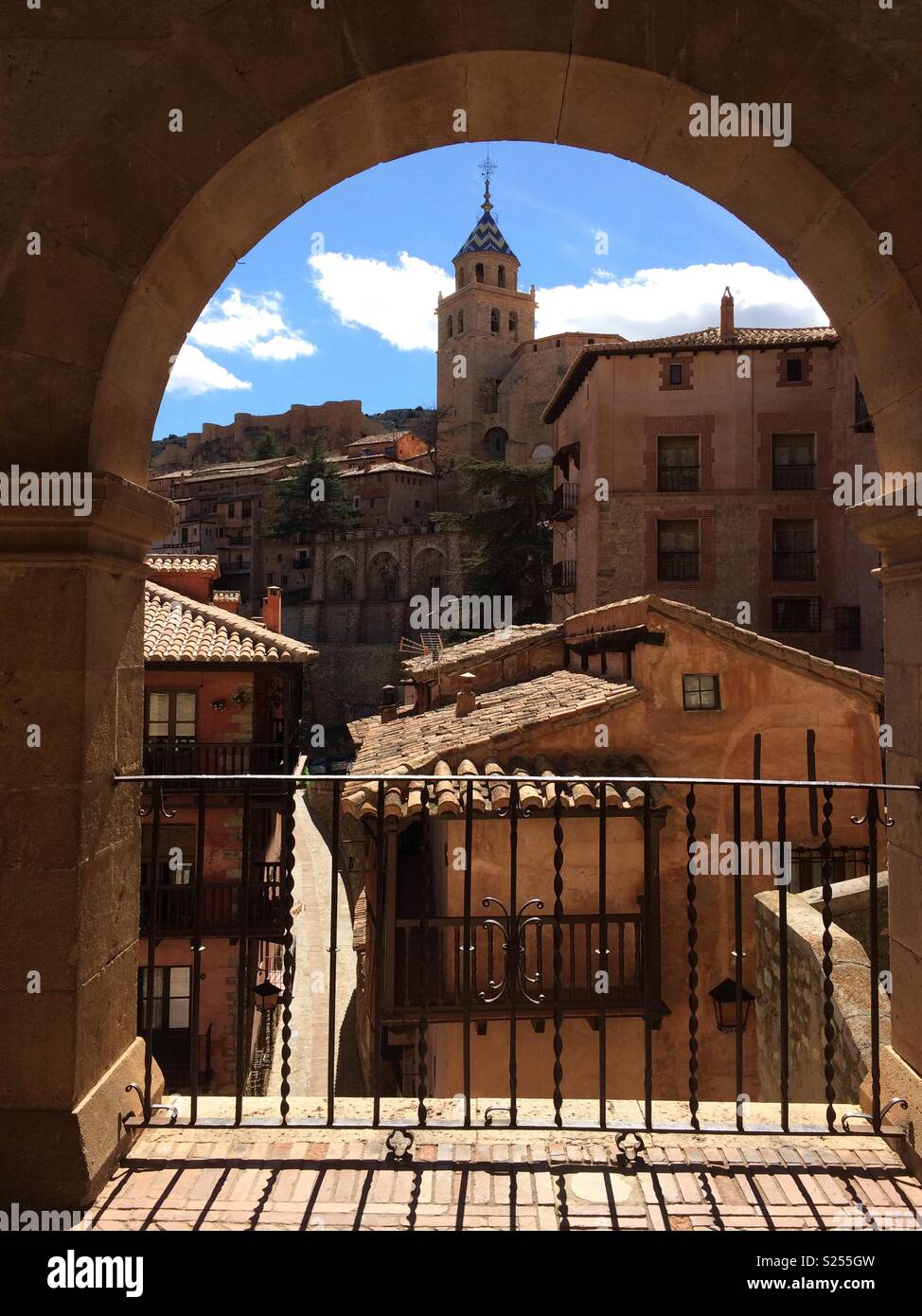 Spanish rooftops through arch Stock Photo - Alamy
