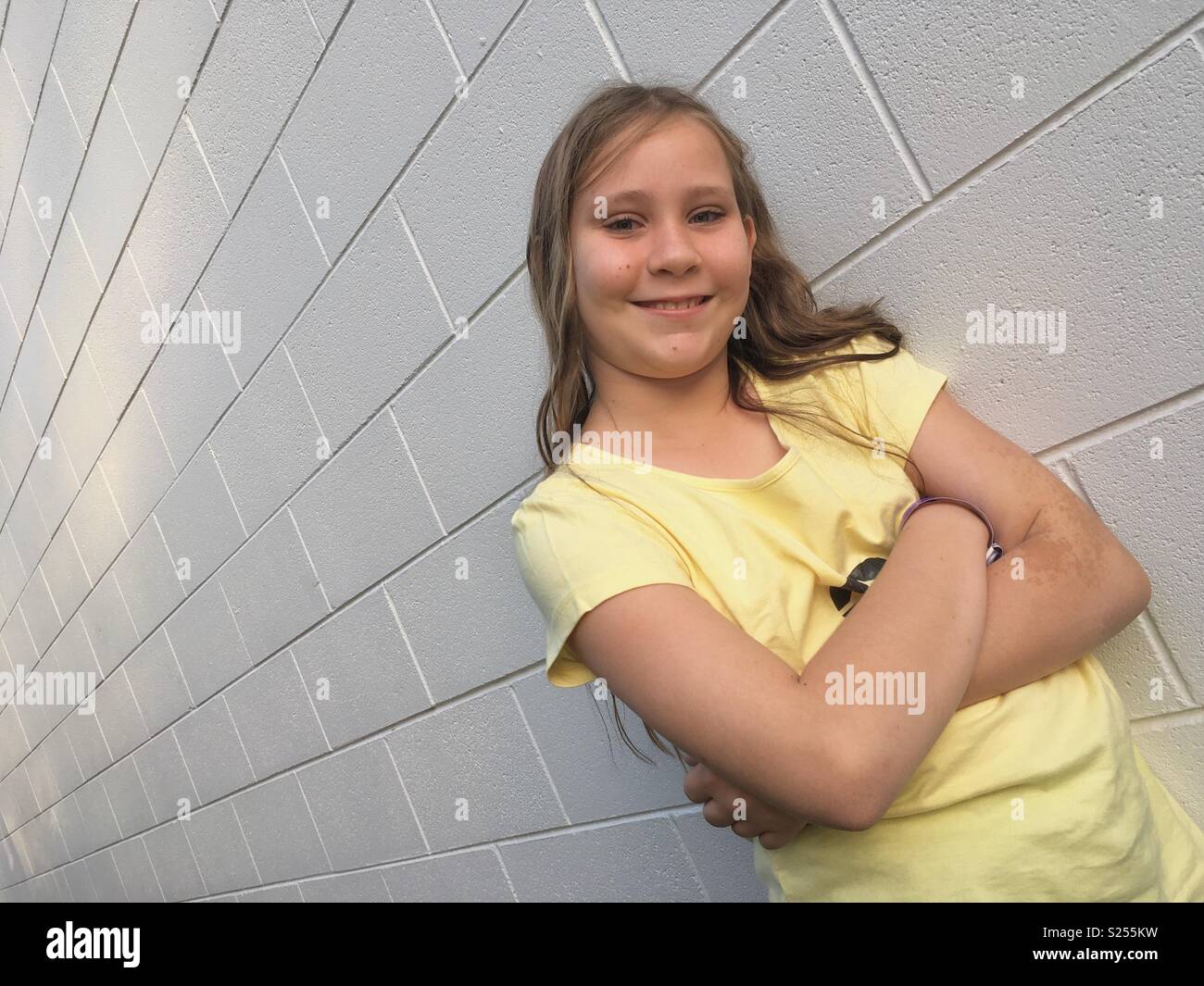 Teen girl standing arms crossed hi-res stock photography and images - Alamy